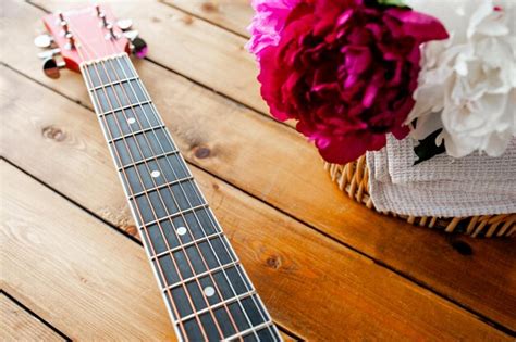 Premium Photo Metal Strings On Neck Of An Acoustic Guitar And