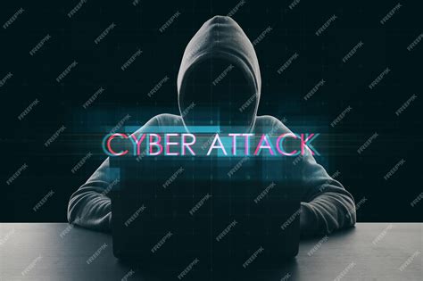 premium photo hacker at desktop using laptop computer with abstract