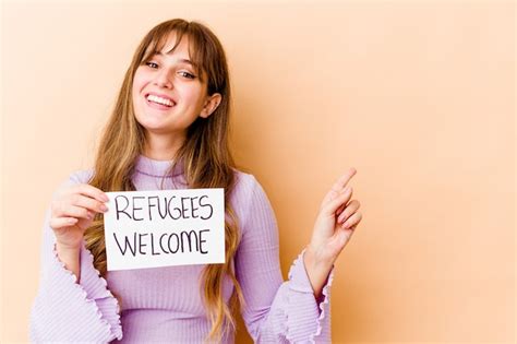 Premium Photo Woman Holding A Refugees Welcome Placard