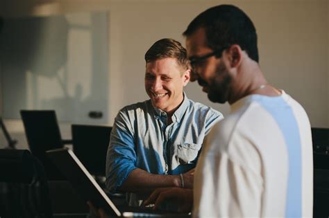 Premium Photo Portrait Of Two Professional Male Programmers Working On Computer In Diverse