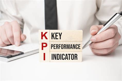 KPI KEY PERFORMANCE INDICATOR Text Wooden Cube Blocks On Table Background Idea Strategy