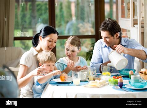 Family eating breakfast together Stock Photo - Alamy