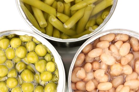Premium Photo Open Tin Cans Of French Bean Beans And Peas Isolated On