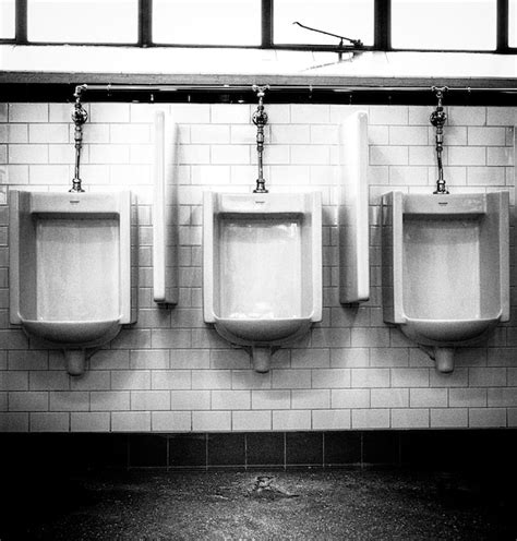 Premium Photo Urinals In Public Restroom