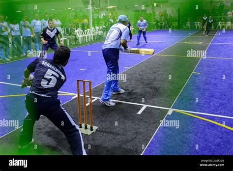 Batsman Leaves A Delivery Down The Leg Side In A Game Of Indoor Cricket