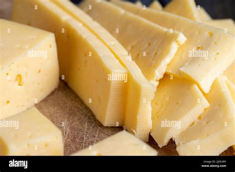 Sliced Natural Cows Milk Cheese Fresh Yellow Milk Cheese On A Board