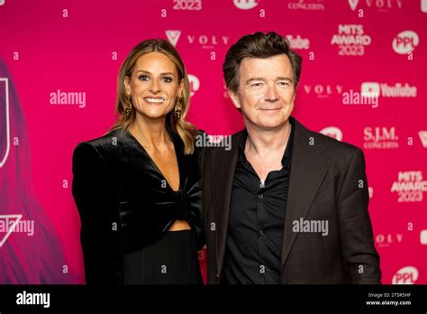 Lucy Dickins And Rick Astley Pose For Photographers Upon Arrival At The