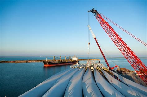 Premium Photo Loading Seaport The Blades Of Wind Turbines In The