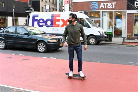 Man In Gray Long Sleeve Shirt And Blue Denim Jeans Online Puzzle