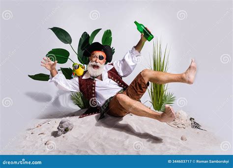 Elderly Pirate Captain With Parrot Celebrates On Beach In Buccaneer