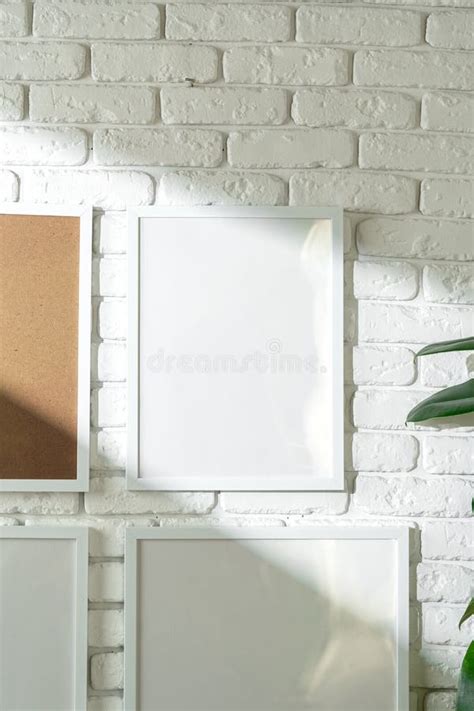 Varied Sized Photo Frames Displayed On A White Brick Wall Stock Image Image Of Customizable