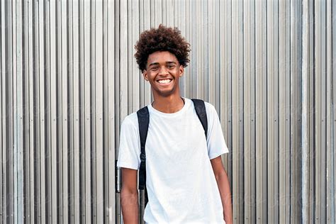 Portrait Of Handsome Afro Man Looking At Camera By Stocksy