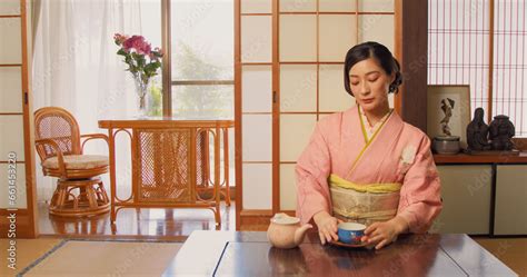 Young Japanese Female Enjoying Time Alone And Drinking Tea At Home