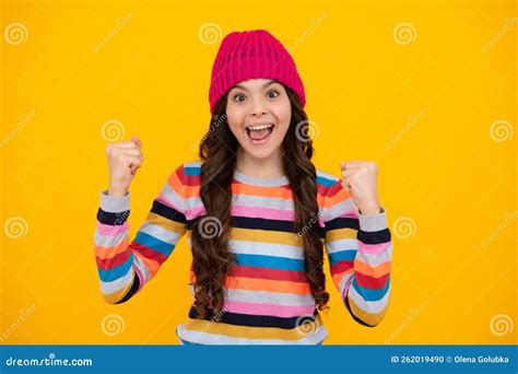 Amazed Teenager Modern Teen Girl Wearing Sweater And Knitted Hat On