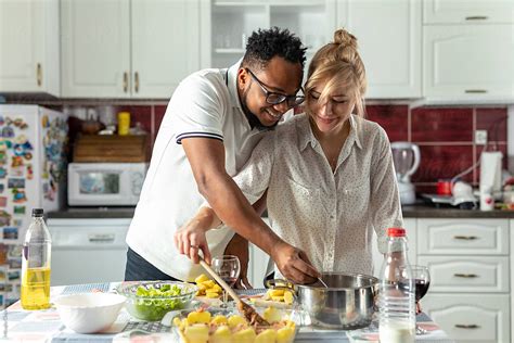 Couple Cooking Together In Kitchen By Stocksy Contributor Mihajlo