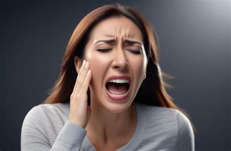 Premium Photo Upset Asian Girl Screams Cries On Dark Grey Background