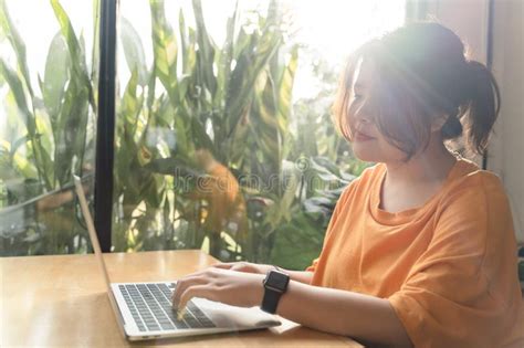Asian Woman Trader Investor Businesswoman Using Laptop For Trading