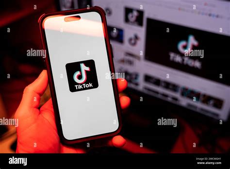 Hand Holding A Apple Iphone Pro Max Smartphone With Tik Tok Logo It Is A Social Media