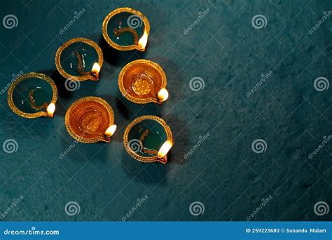 Happy Diwali Festival Of Lights Teal Color Background With Golden And