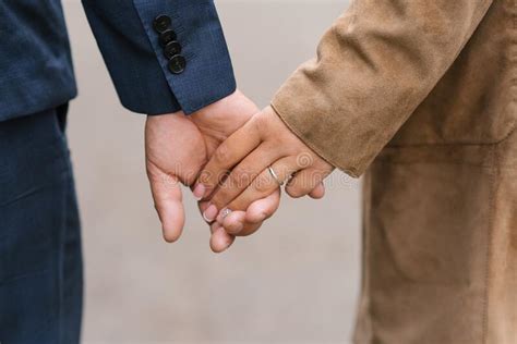 Man And A Woman Hold Hands On A Walk Couple In Love Stock Image