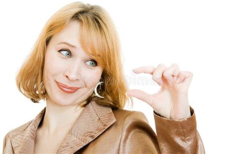 A Woman Looks At A Small Object In His Hand Stock Image Image Of