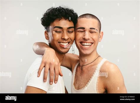 Young Gay Couple In Love On A White Background Two Young Androgynous