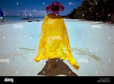 A Womens Sarong Blows In The Silght Winds On White Sand Beach In The
