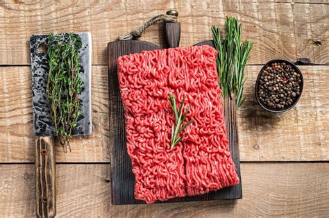 Premium Photo Fresh Raw Mince Beef Meat On A Butcher Cutting Board