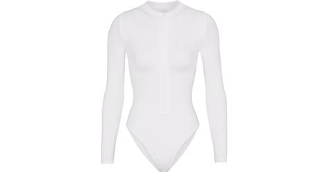 Skims Swim Zip Front Long Sleeve One Piece In Marble White Lyst