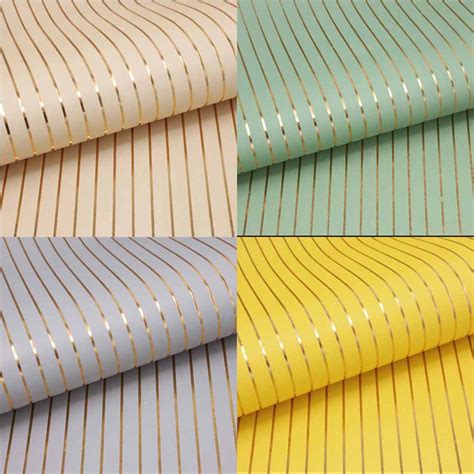 خرید کاغذ کادو گلاسه طلاکوب طرح راه راه بسته 50 برگی