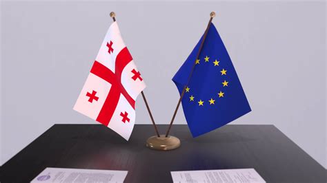 Georgia And Eu Flag On Table Politics Deal Or Business Agreement With