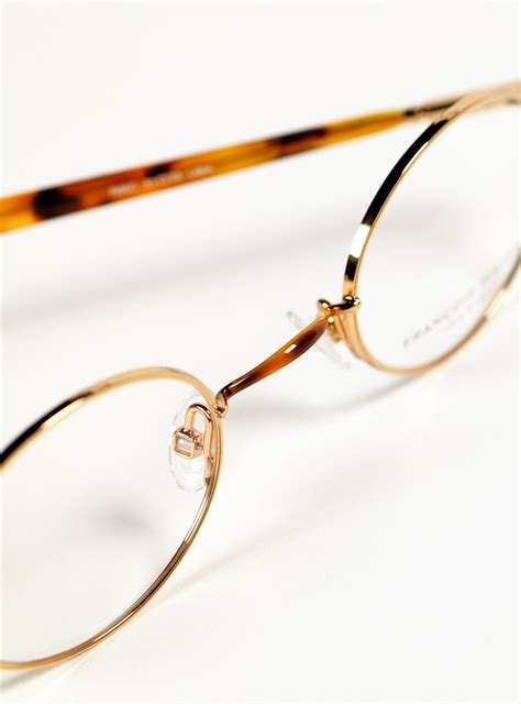 Nearly Oval Wire Frame In Gilted Metal With Amber And Tortoise The
