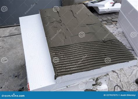 Installation Of Styrofoam Insulation Sheets On House Facade Wall For