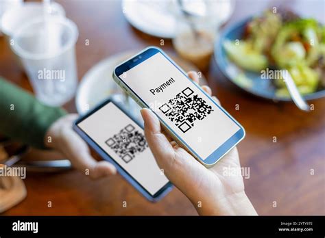 Hand Using Mobile Phone Application To Scan Qr Code Hands Holding Mobile Phone Qr Code Payment
