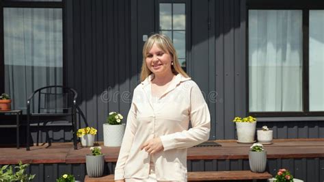Estate Agent Shaking Hands With Clients Ready For Purchase Stock