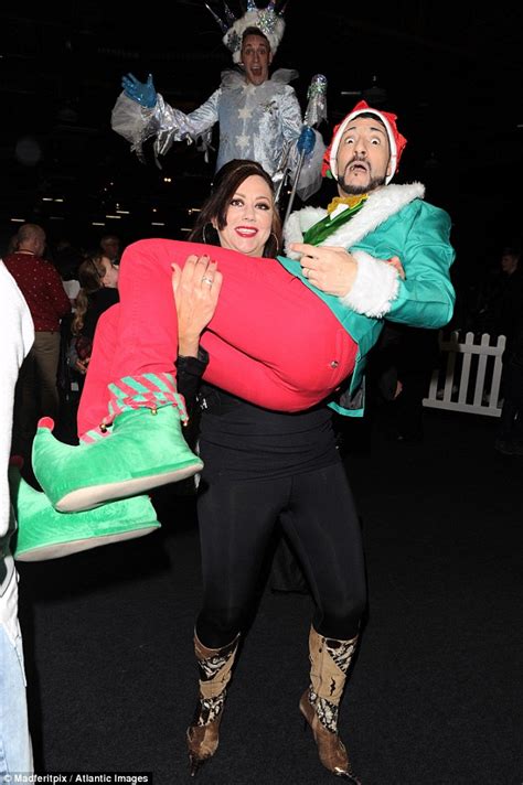 Lisa Appleton Scoops Up Grown Man In Elf Suit At Winter Wonderland