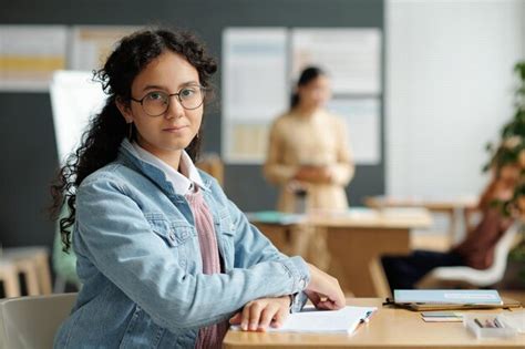 Premium Photo Young Serious Multiethnic Schoolgirl In Eyeglasses And