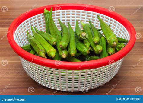 Okra Or Bhindi Bamia Vegetable Stacked In A Basket On Wood Background