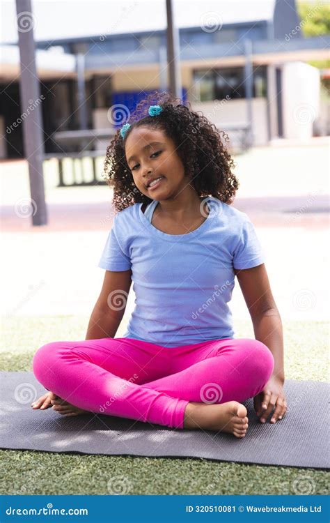 Biracial Girl Practices Yoga Outdoors At School Stock Image Image Of