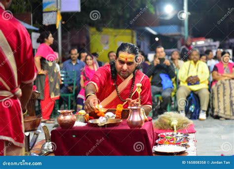 Nepalese Hindu Priest Performing Aarti Ceremony At The Lakeside In