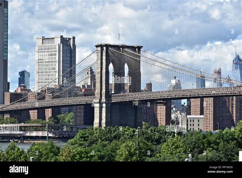 The Iconic Brooklyn Bridge Spanning The East River Between Lower