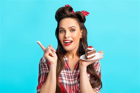 Young Pinup Woman In Old Fashioned Dress And Gloves Blowing Air Kiss At