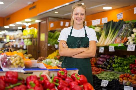 Portrait Of A Smiling Girl Who Works Part Time In A Store As A Trainee