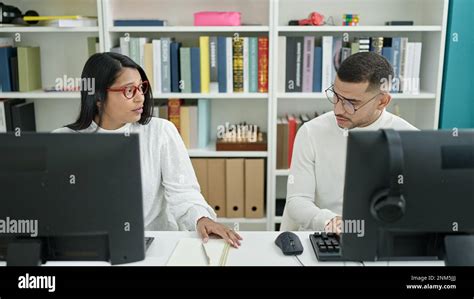 Man And Woman Babes Using Computer Studying At University Classroom Stock Photo Alamy