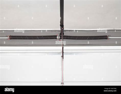Overhead Sectional Door Mechanism Or Components Close Up Of Torsion Spring Quick Connect Door