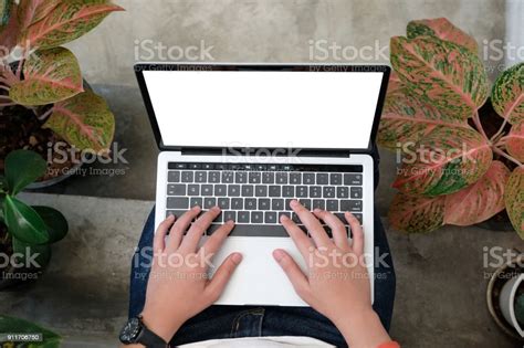 Man Hands Typing Laptop Computer With Blank Screen For Mock Up Template Background Top View