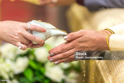 Selective Focus With Thai Wedding Ceremony Water Pouring From Conch