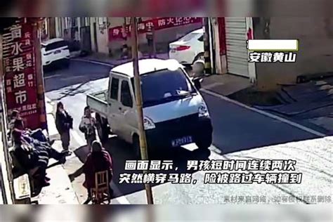 男孩短时间连续两次突然横穿马路，险被路过车辆撞