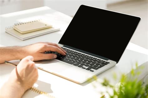 Premium Photo Man Using Laptop And Writing