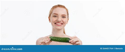Cheerful Happy Beautiful Girl With Cucumber On Her Hand Isolated On